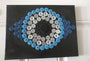 Evil eye button art work with vintage buttons on canvas